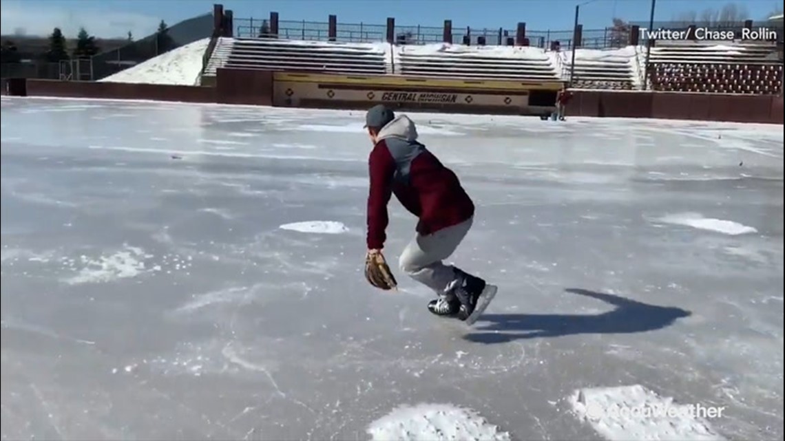 Baseball player trades cleats for ice skates after field becomes icy ...