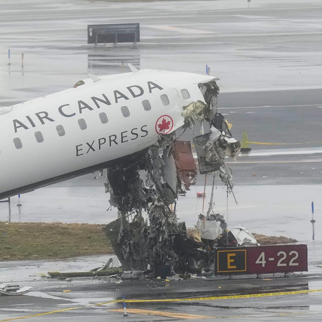 Flight attendant found buckled into seat outside plane after LaGuardia ...