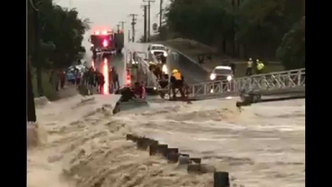 Dramatic high-water rescue: SAFD saves man stranded on SUV | king5.com