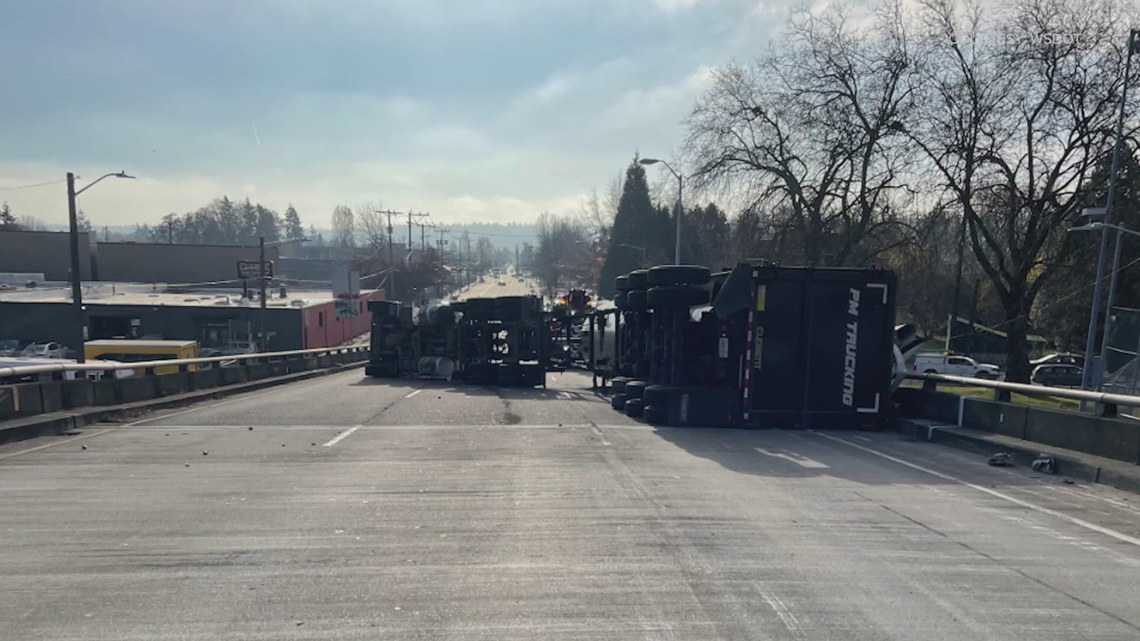 Semi-truck rolls, loses load of aluminum on I-5 off-ramp in Seattle | king5.com