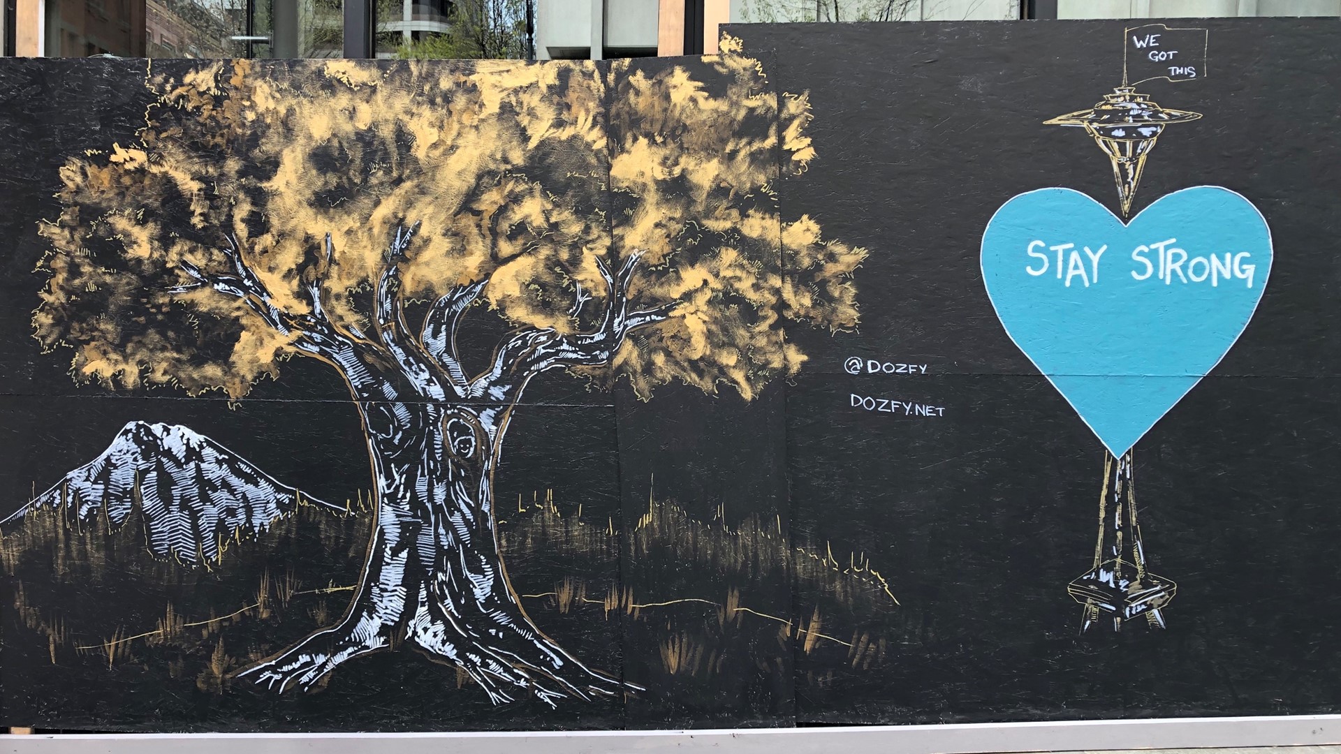 Seattle artist Dozfy brings beauty to boarded-up businesses | king5.com