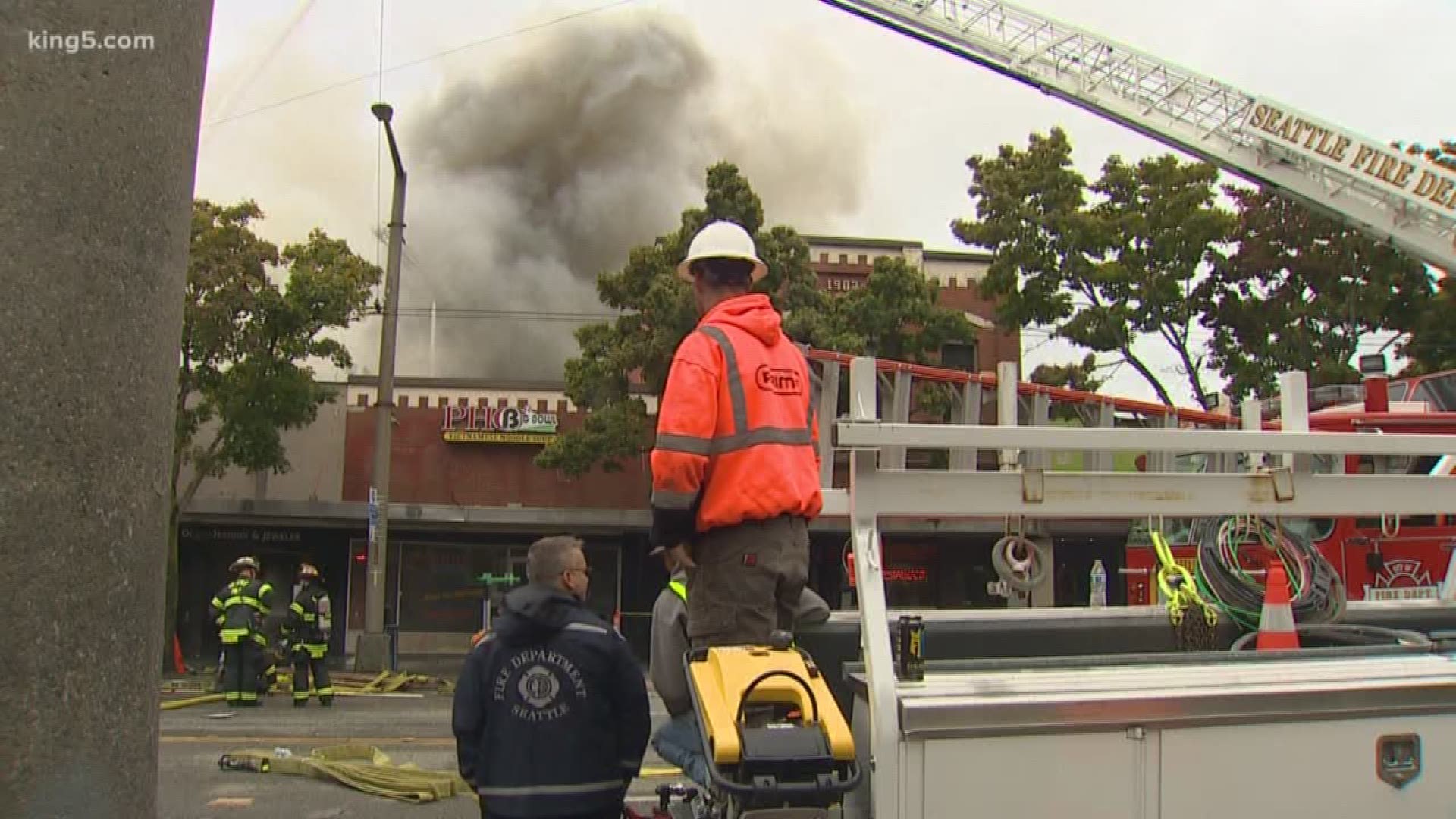 Firefighters cleaning up after fire in Ballard | king5.com