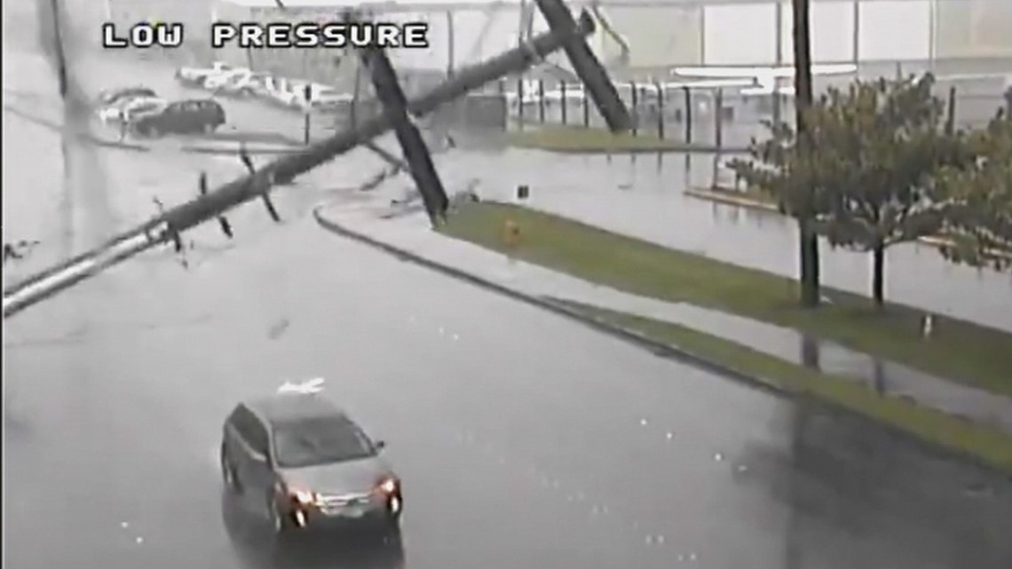 Traffic cameras capture moment power pole collapsed on car near Tukwila ...
