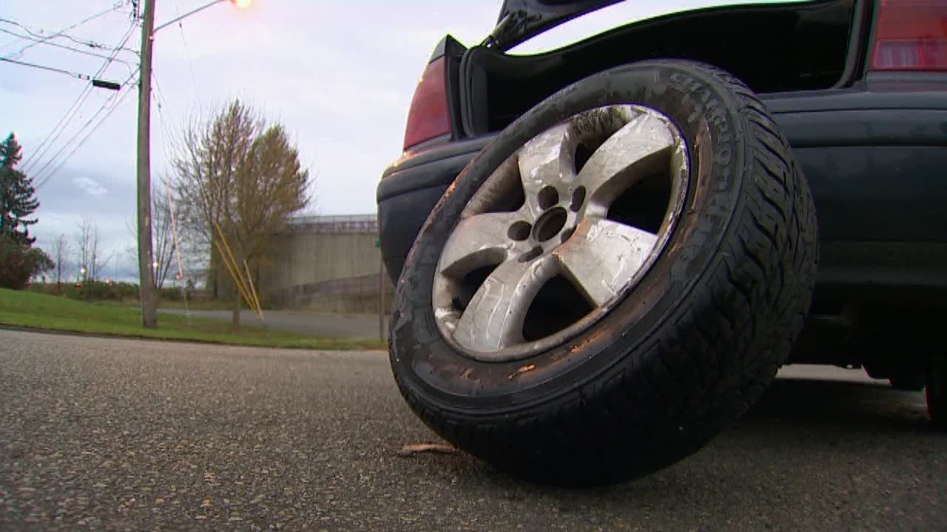 Pothole on I-5 flattens tires. This guy changed them for total ...