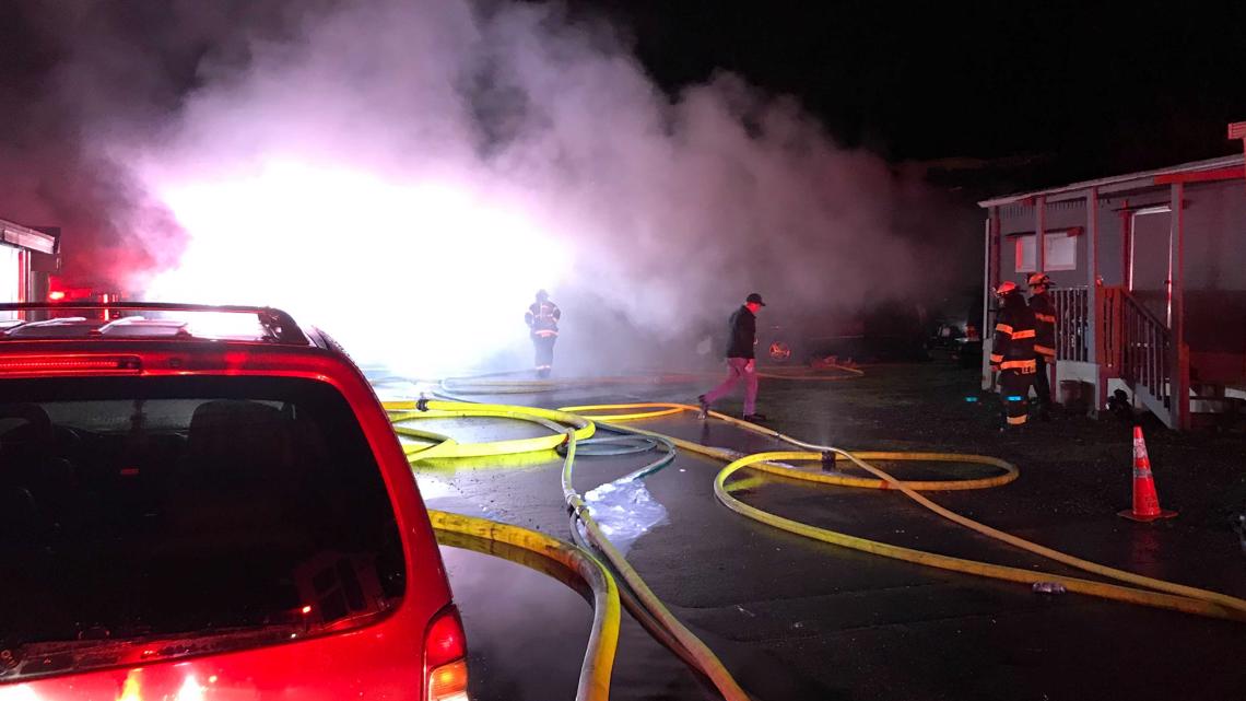 One dead after mobile home catches fire in Covington | king5.com