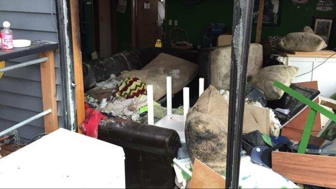 Damage left after SWAT officers confront a home invader | king5.com
