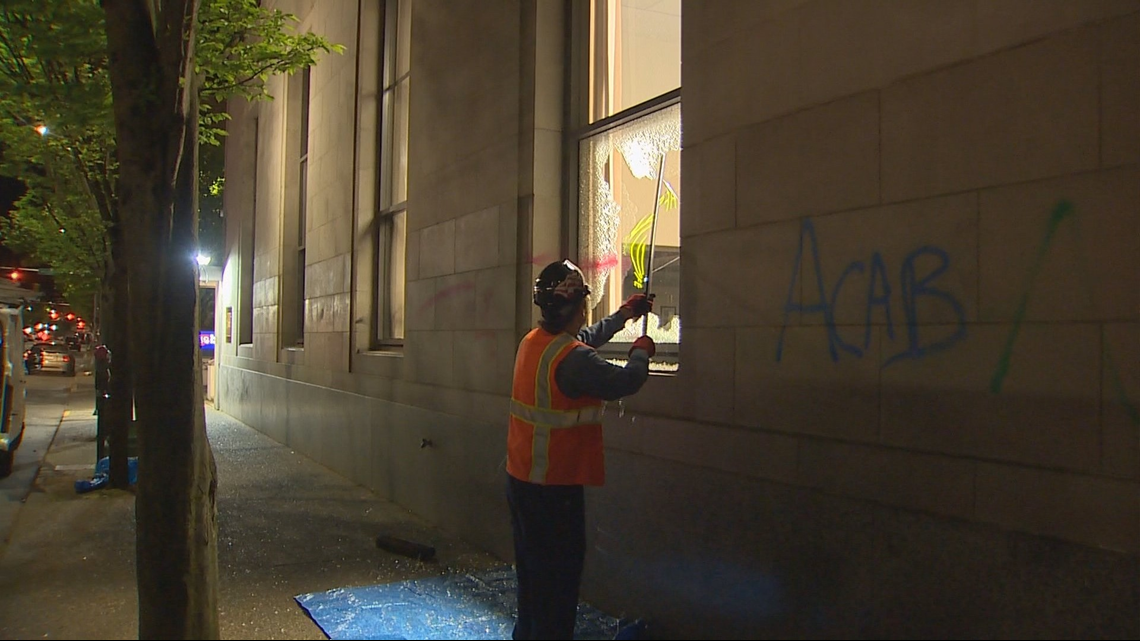 Vandals break windows, spray paint buildings in downtown Olympia ...