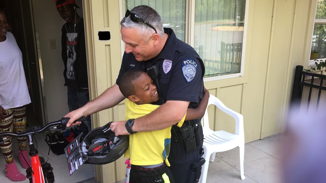 Kent police officer surprises boy with new bike | king5.com