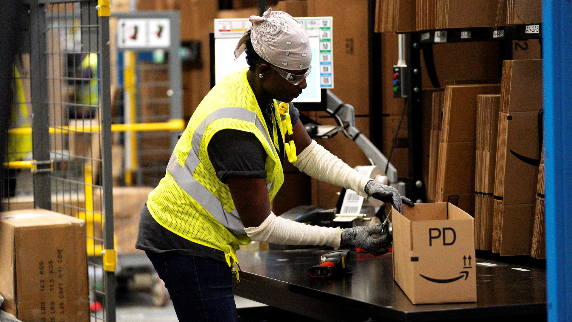 After backlash, Amazon to boost pay for longtime workers | king5.com