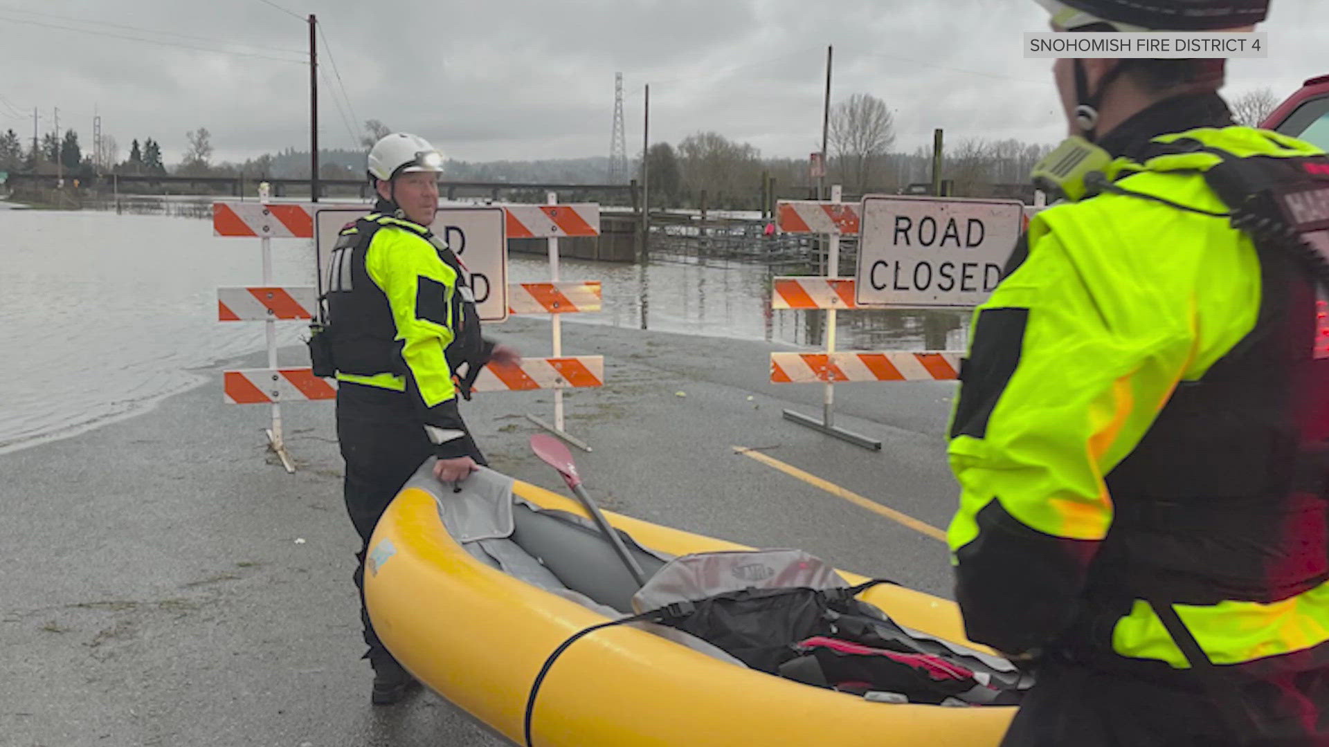 Emergency crews rescue driver from truck disabled by Snohomish flood ...