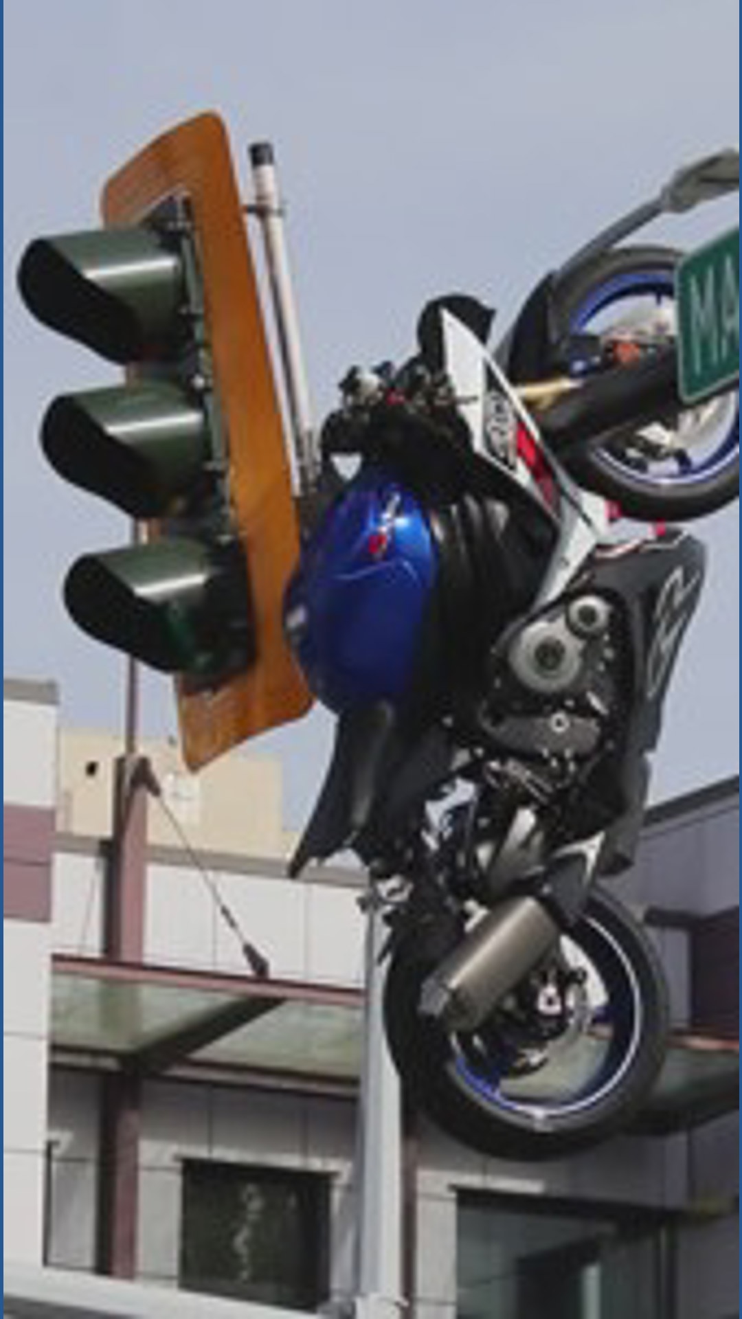 Motorcycle ends up on traffic light in Vancouver, B.C. | king5.com