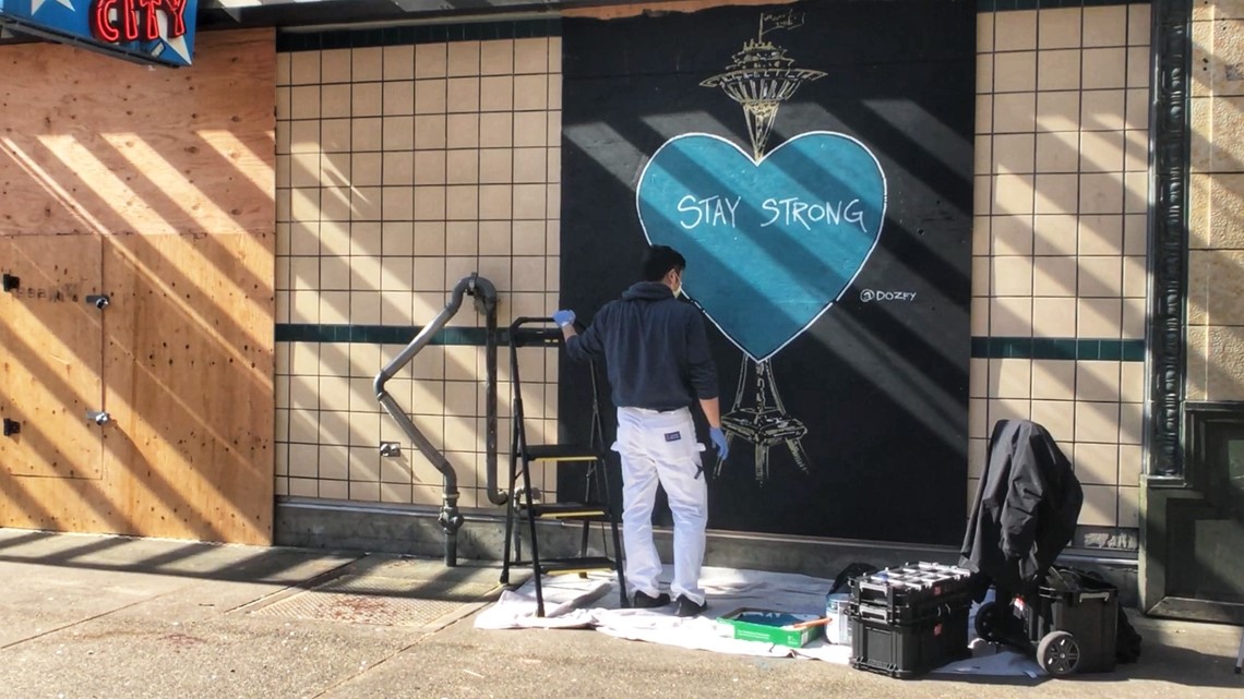 Seattle artist Dozfy brings beauty to boarded-up businesses | king5.com