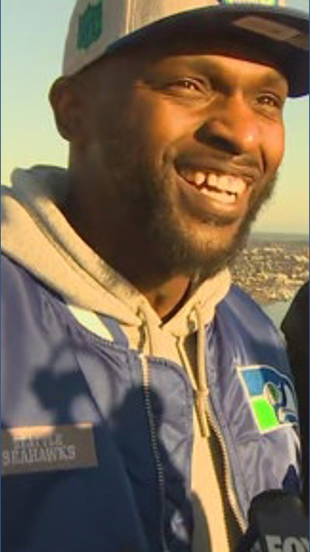 Seahawks legend Cliff Avril raises 12 flag over Space Needle | king5.com