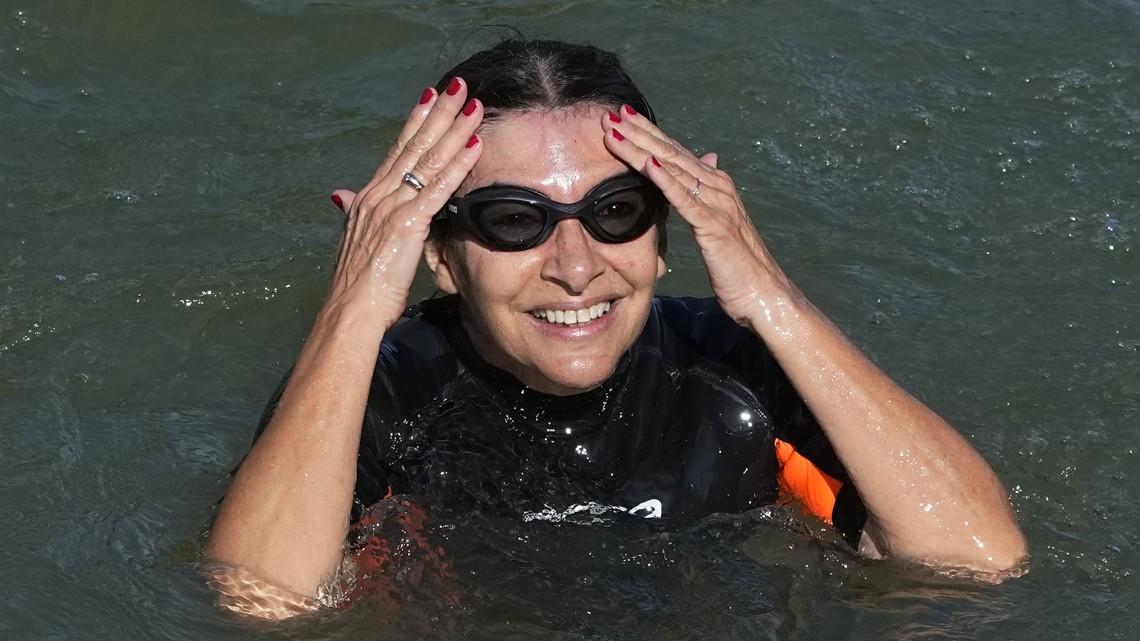 Paris mayor dips into the Seine River to showcase its improved ...