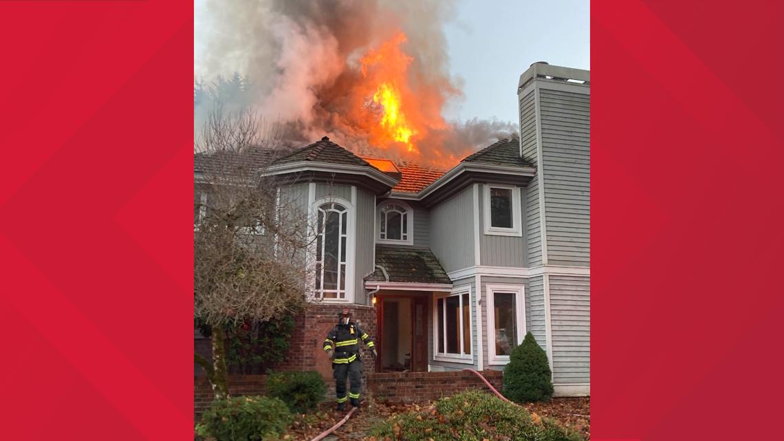 911 caller saves contractor from Bellevue house fire | king5.com