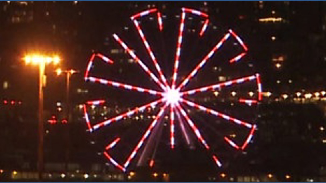 Seattle Great Wheel displays candy canes for Christmas | king5.com