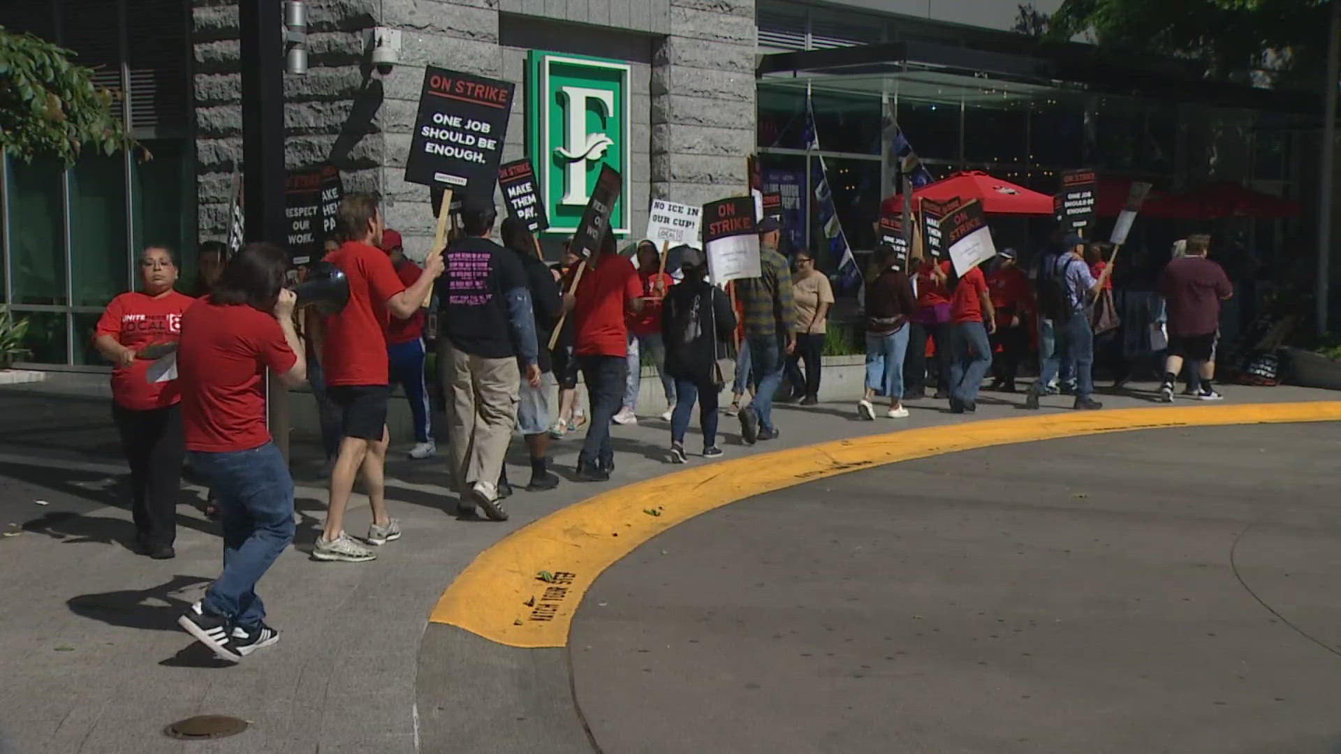 Embassy Suites workers near Lumen Field strike as more World Cup fans ...