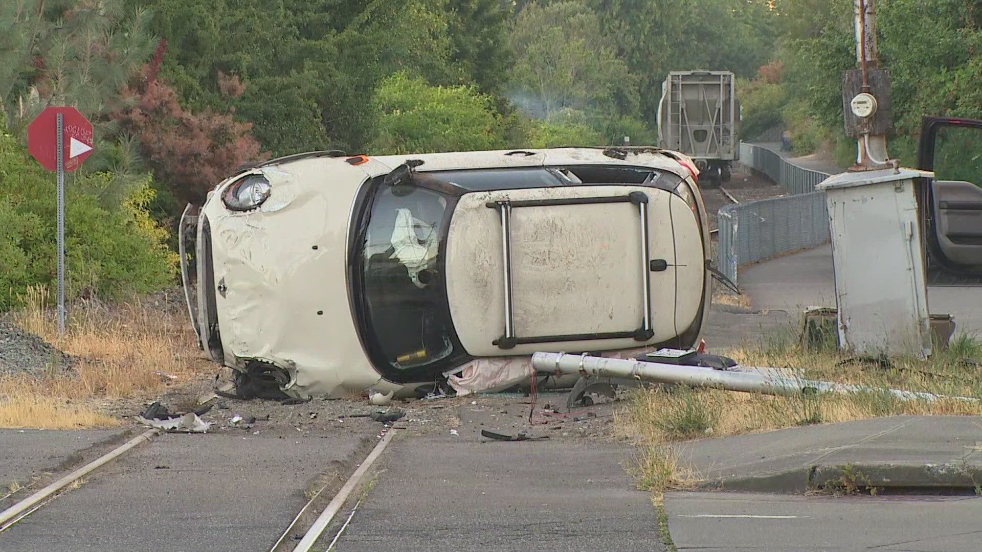 BREAKING: Car rolls over onto train tracks in Ballard | king5.com