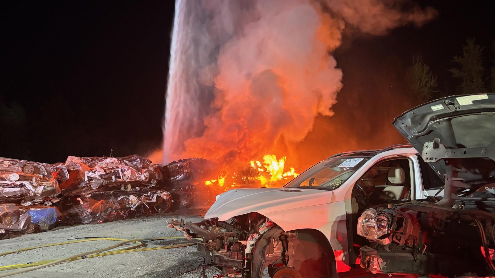 Explosions reported as fire burns stacks of vehicles at Graham wrecking ...