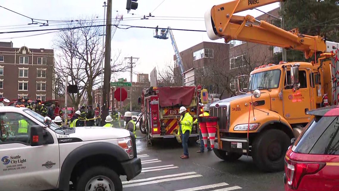 Operator rescued after crane crashes into power pole in Queen Anne ...