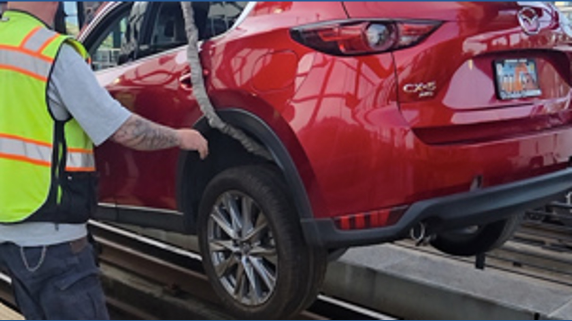 Car on Light Rail Tracks | king5.com