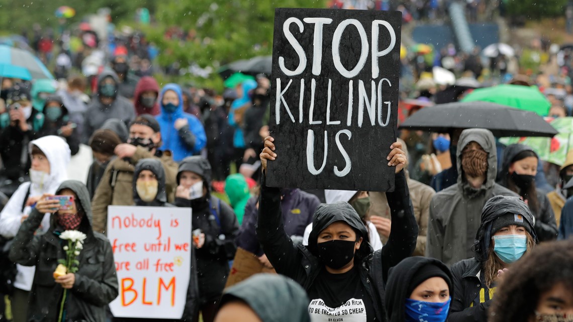 Thousands silently march in support of Black Lives Matter in Seattle ...