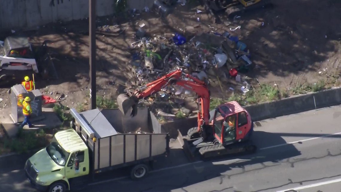 Crews clean up homeless encampments near I-90 in Seattle after rock ...