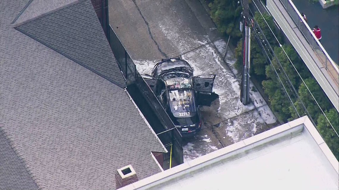 Aerials: Seattle police car set on fire in South Lake Union, suspect ...