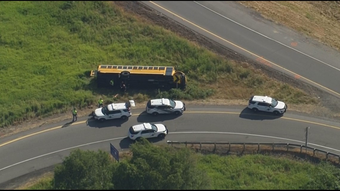 School bus with adults and students on board rolls in Burlington, minor ...