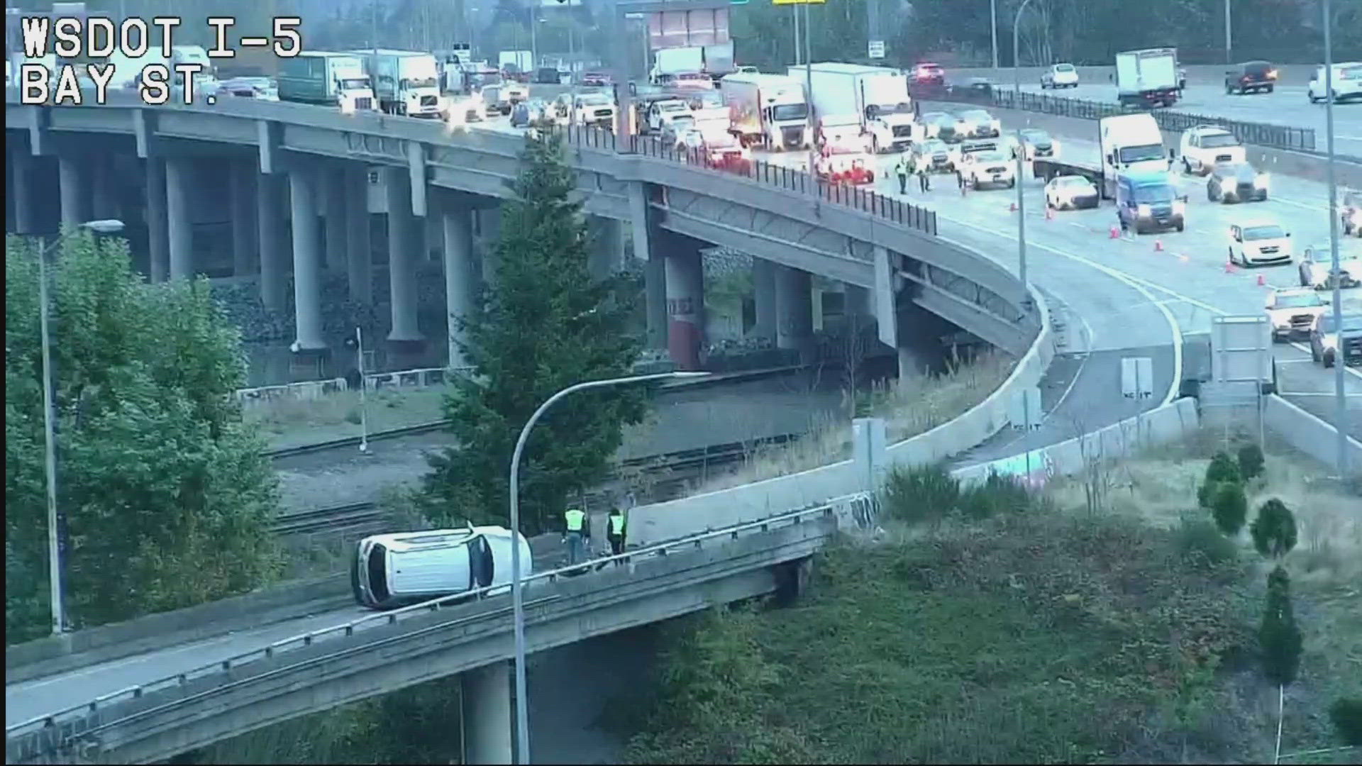 Vehicular assault leads to flipped car on I-5 offramp | king5.com