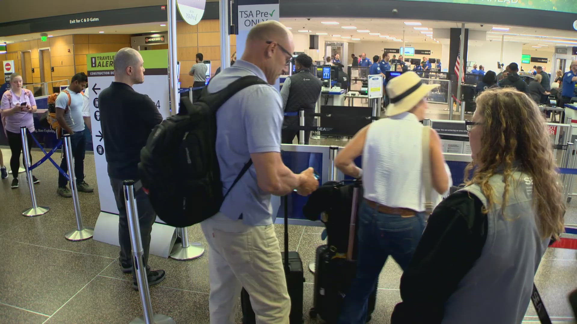 Travelers keep shoes on at SEA Airport as TSA rolls out new security ...