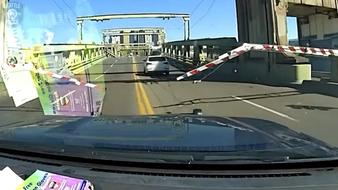 Dashcam video shows moments stolen vehicle jumps partially-open ...