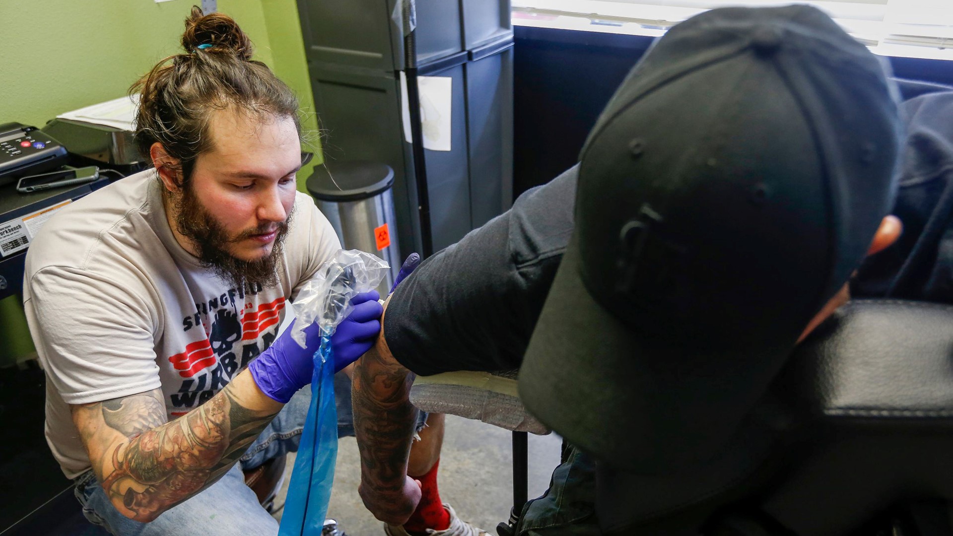 Tattoo artist offers second chances, covering up racist tattoos for ...